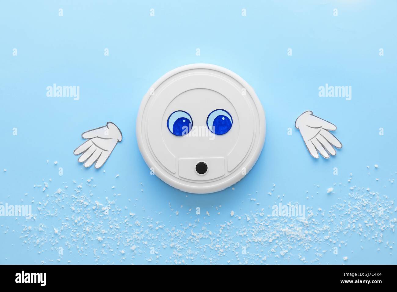 Modern robot vacuum cleaner with drawn eyes and paper hands on blue ...