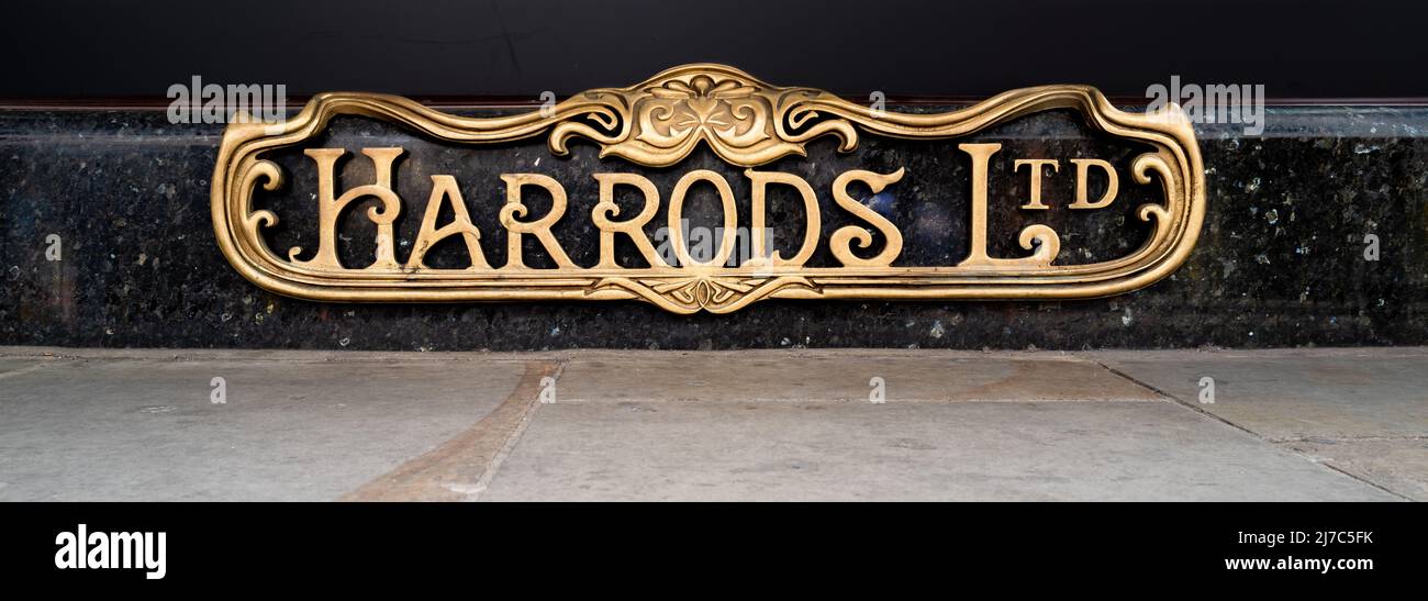 London, UK - 17 April 2022: Art deco brass pavement level Harrods sign ...