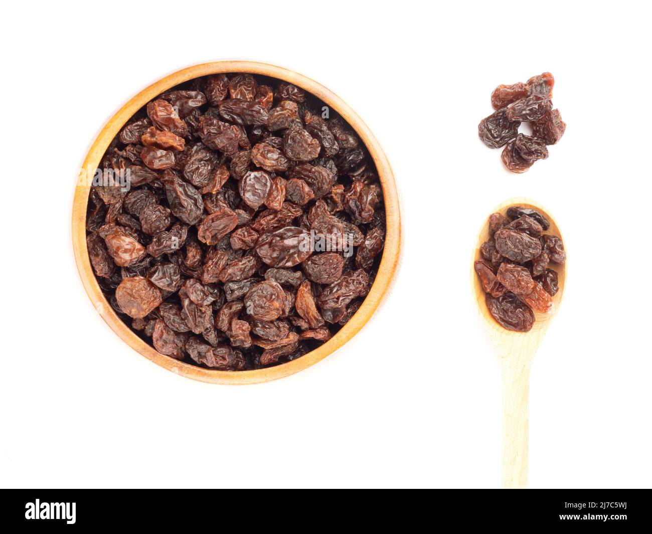 Raisin in brown wooden bowl, spoon, bunch, isolated on white background ...