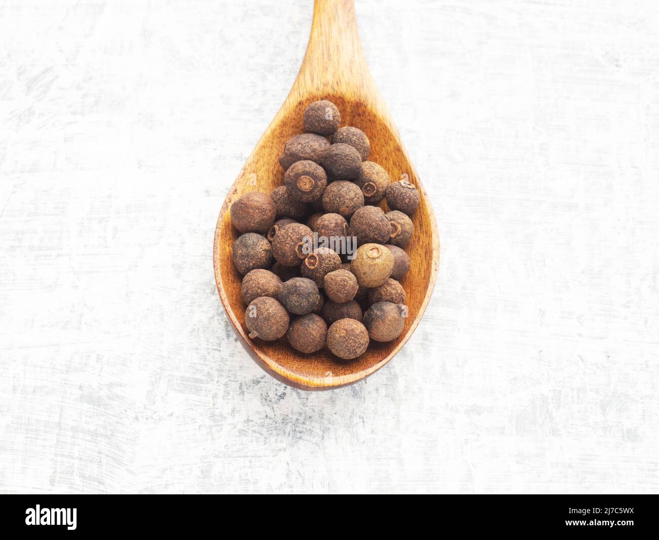 Spice Allspice (Jamaica pepper, Pimento) in wooden spoon on white ...