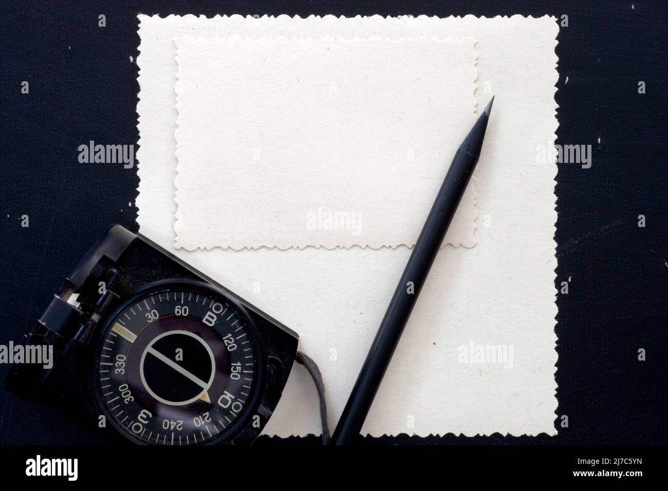 Old compass and photos back side Stock Photo - Alamy