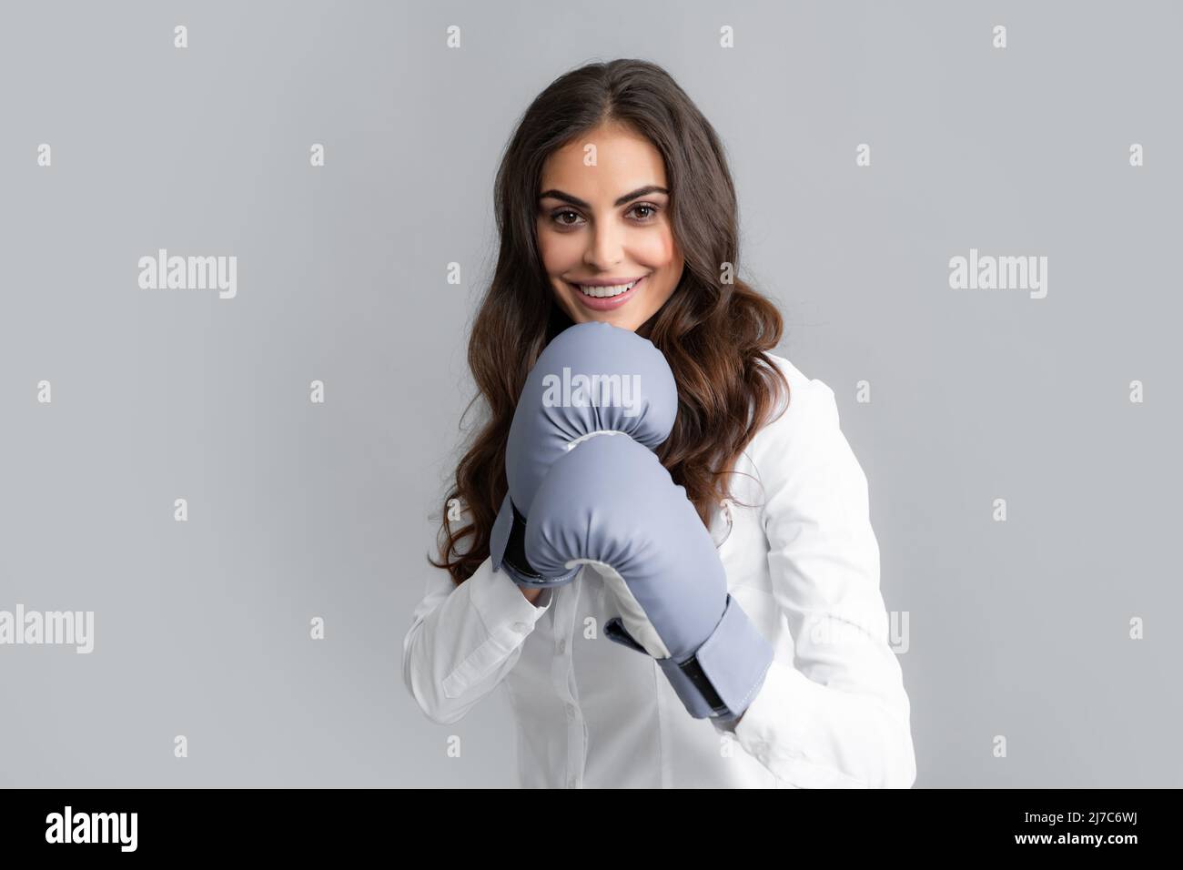 Woman in boxing gloves. Strong happy business woman boss executive ...
