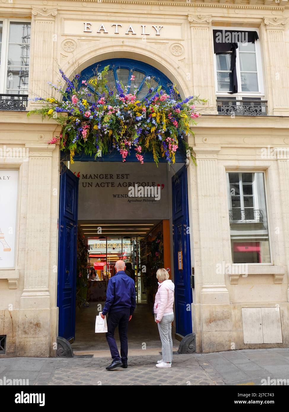 People looking into the main entrance of Eataly, an Italian food center ...