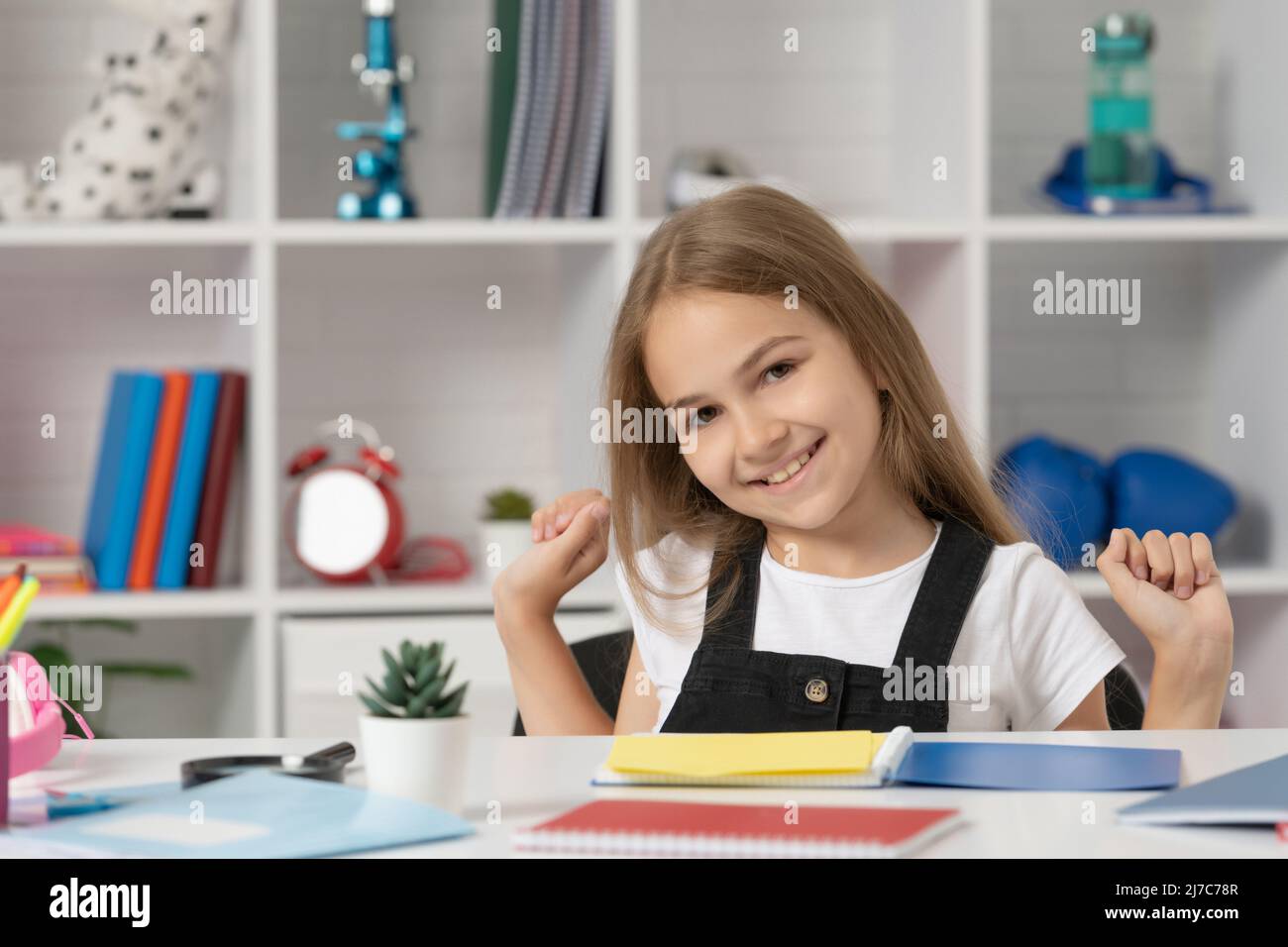 happy girl in classroom on school break Stock Photo - Alamy