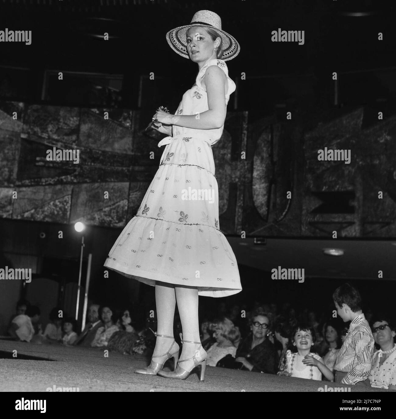 Model on the runway during a fashion show in communist Romania, approx ...
