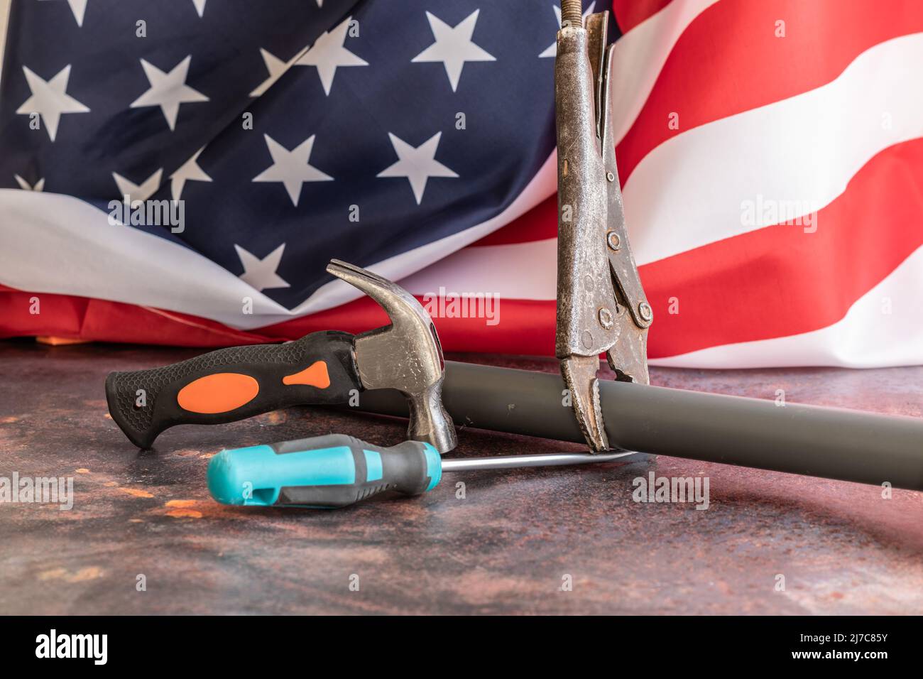 Tools with U.S. flag on a rusted metal table Stock Photo - Alamy