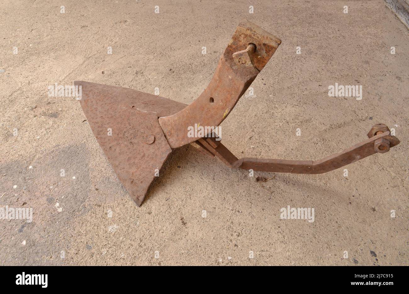 Rusted old metal plow used in first half of 20th century by farmers ...