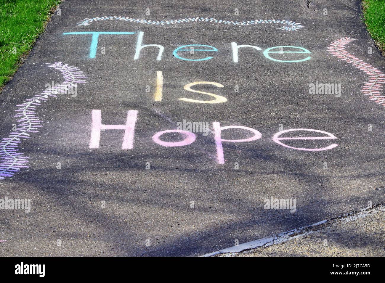 An uplifting chalk art message "There is Hope" on our driveway Stock ...