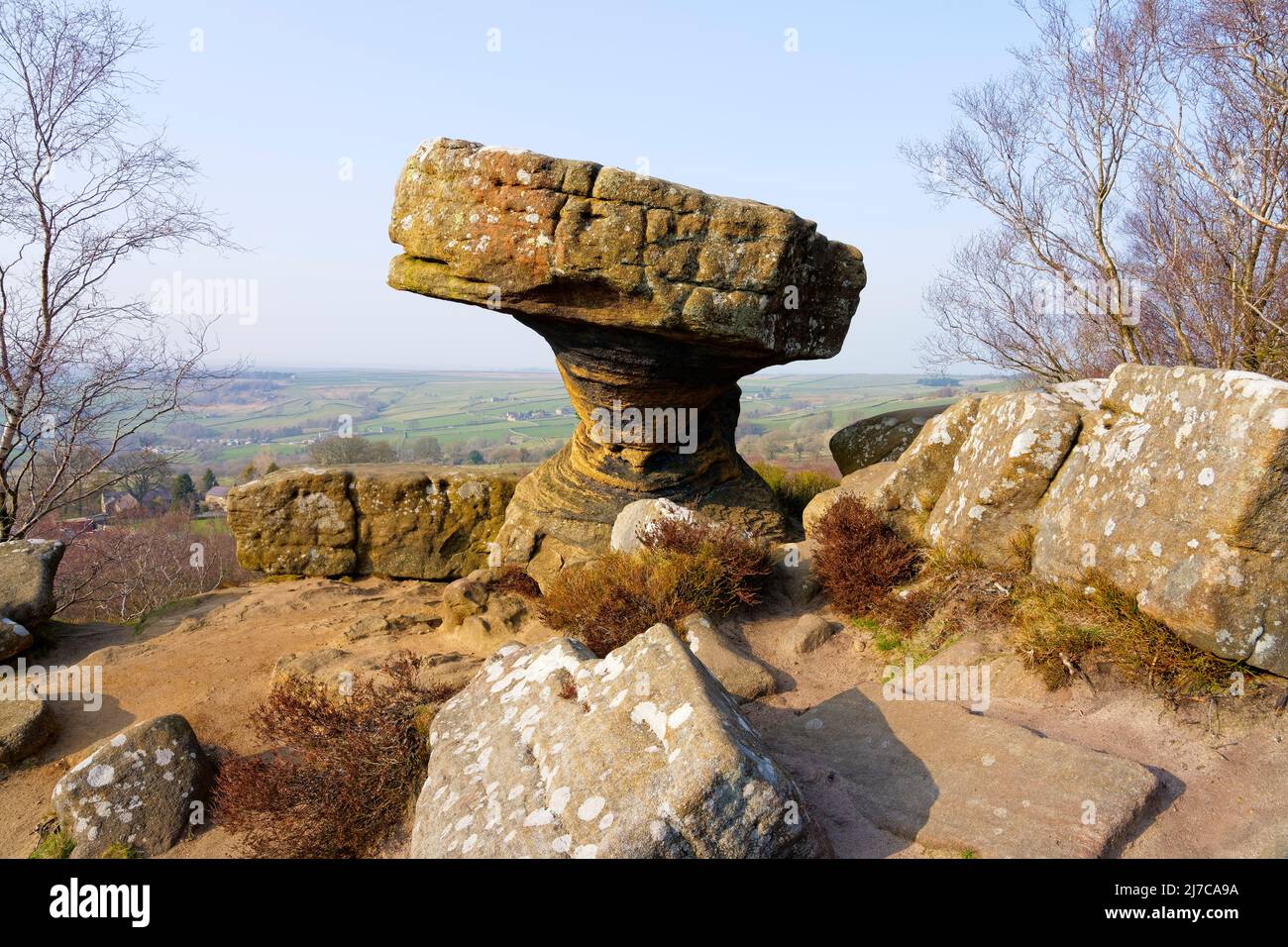 High above a misty Yorkshire landscape stands a weathered gritstone ...