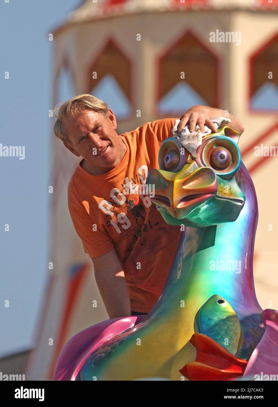 John-Henry Roper polishes the Sea Dragon, beneath blue skies at the ...