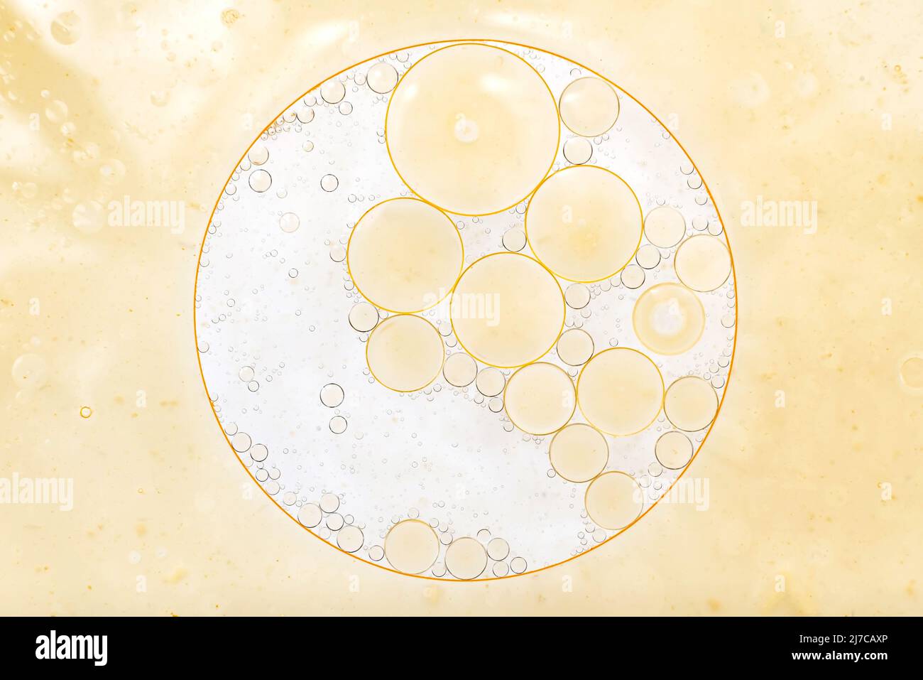 Drops of fat in water. Bubbles of fat close up Stock Photo - Alamy