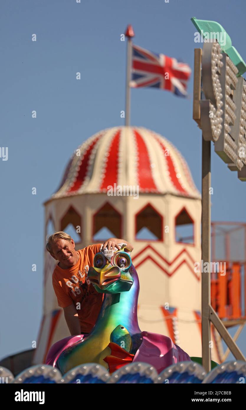 John-Henry Roper polishes the Sea Dragon, beneath blue skies at the ...