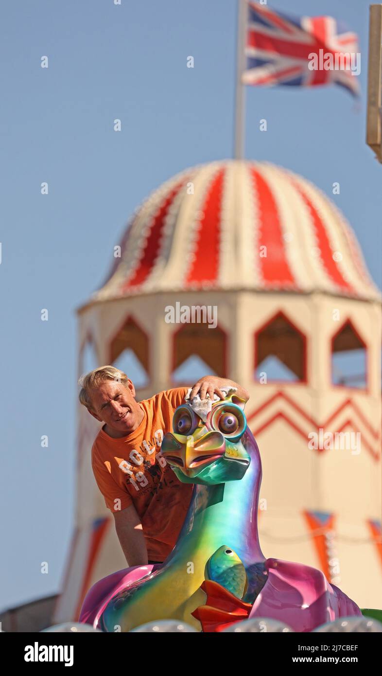 John-Henry Roper polishes the Sea Dragon, beneath blue skies at the ...