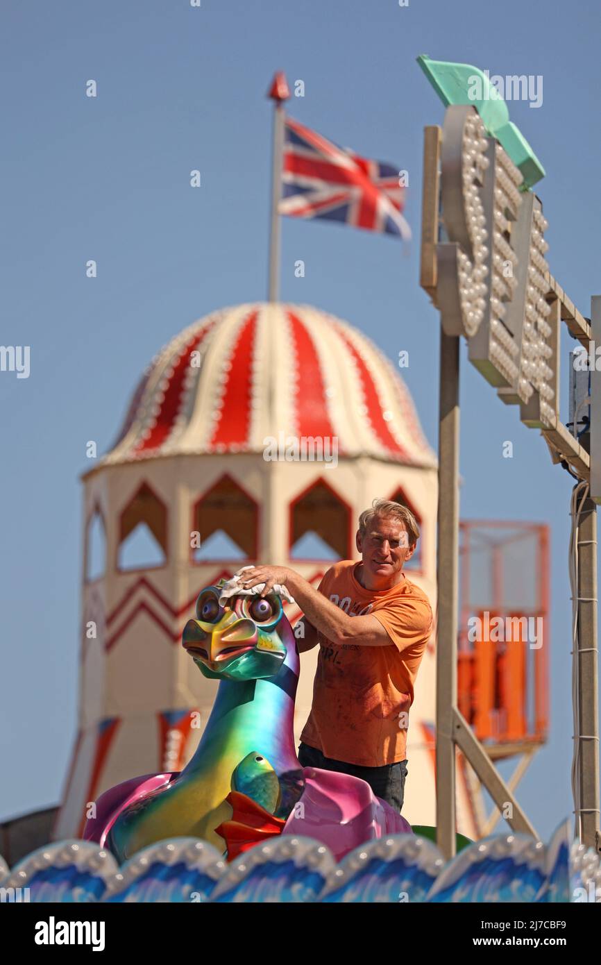 John-Henry Roper polishes the Sea Dragon, beneath blue skies at the ...