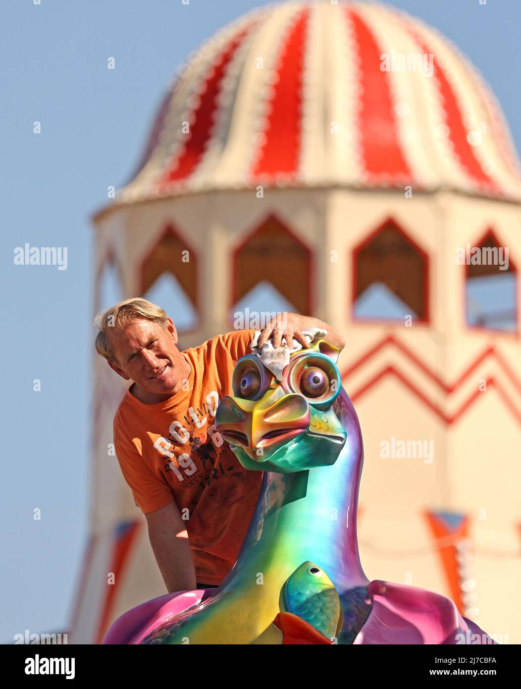 John-Henry Roper polishes the Sea Dragon, beneath blue skies at the ...
