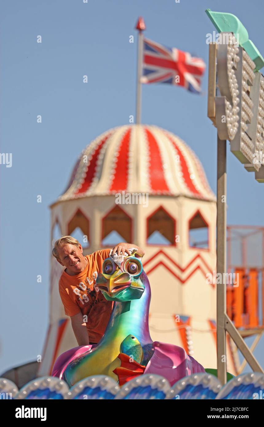 John-Henry Roper polishes the Sea Dragon, beneath blue skies at the ...