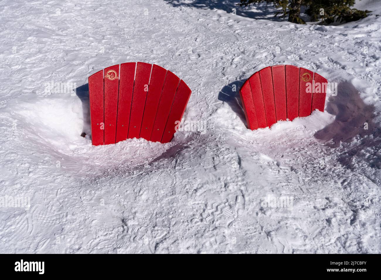 Red chair in snow during winter. Banff National Park, Canadian Rockies ...