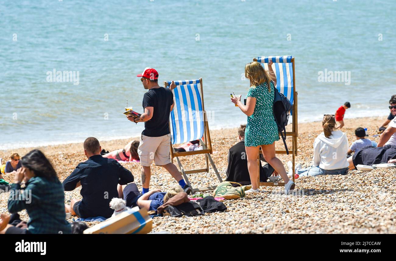 Brighton UK 8th May 2022 - Visitors enjoy a hot sunny day on Brighton ...