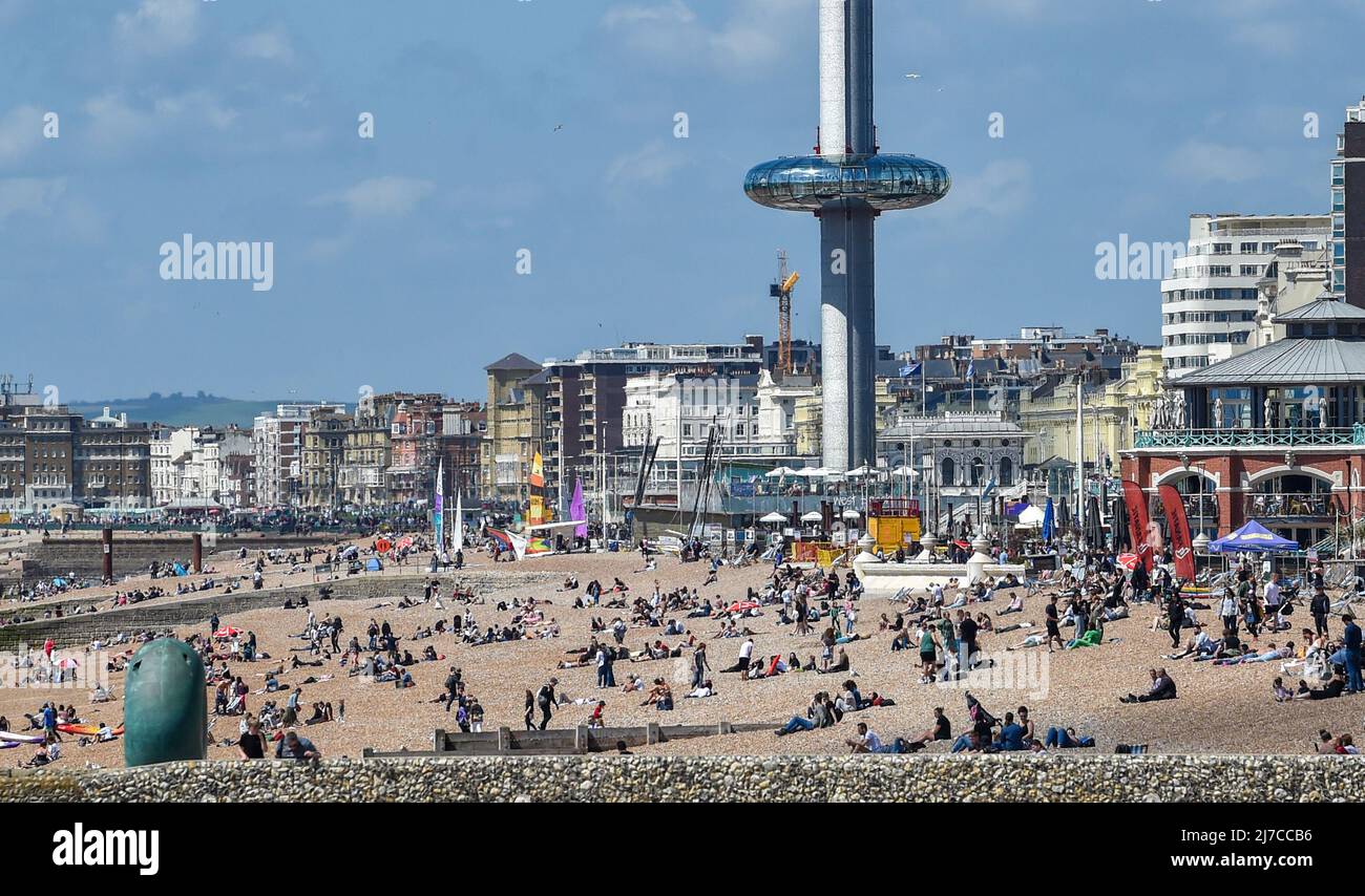 Brighton UK 8th May 2022 - Visitors enjoy a hot sunny day on Brighton ...