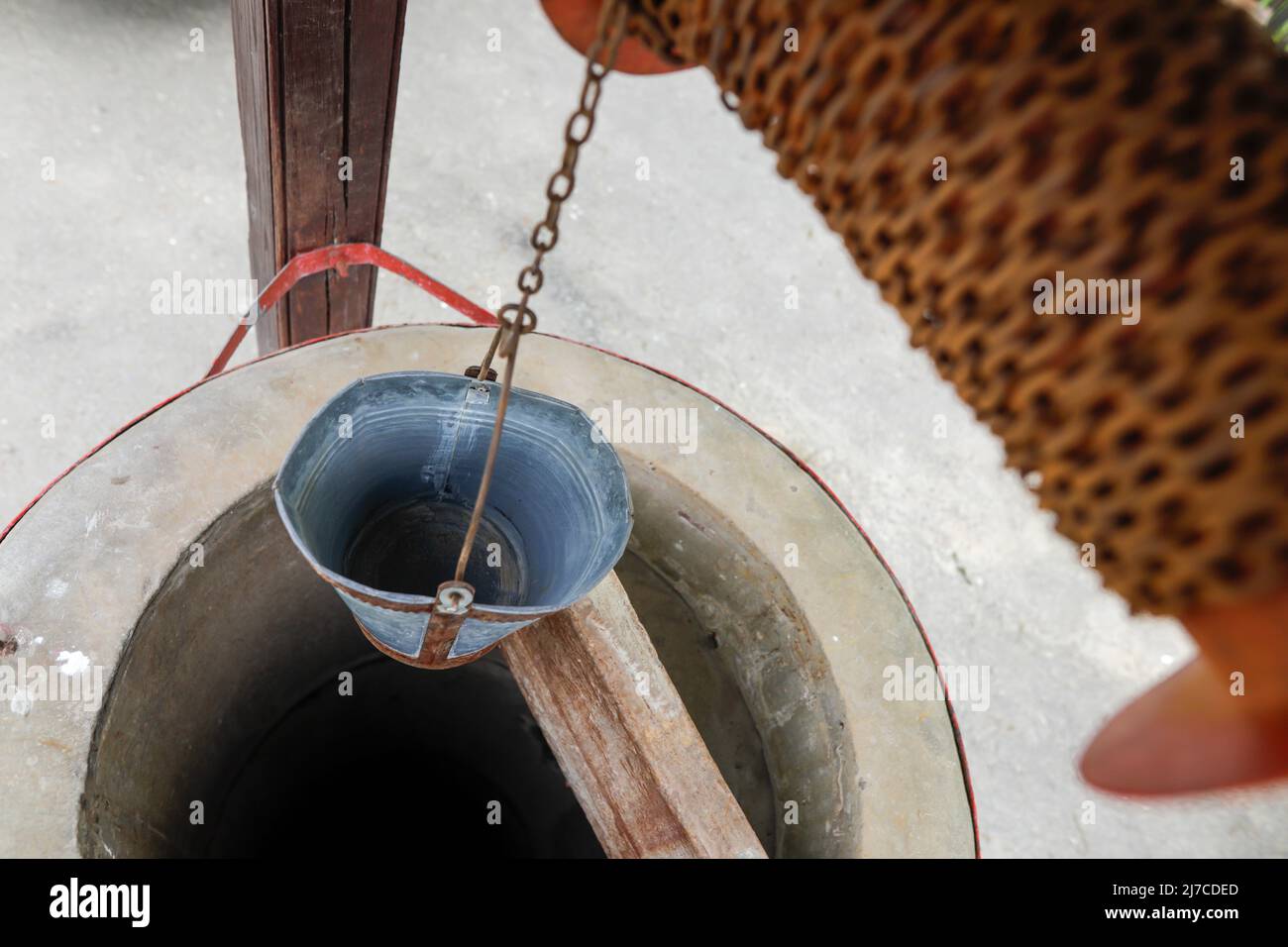 Shadow depth of field (selective focus) details with an old well with ...