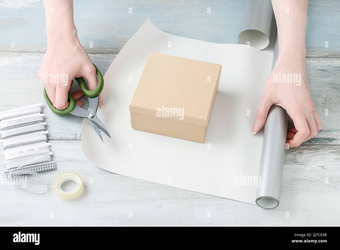 How to wrap and decorate christmas gift. Step by step, tutorial Stock ...