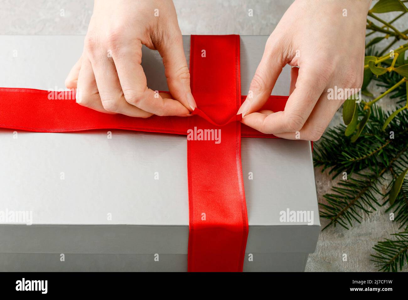 How to decorate christmas gift. Step by step, tutorial Stock Photo - Alamy How to decorate christmas gift. Step by step, tutorial Stock Photo - Alamy