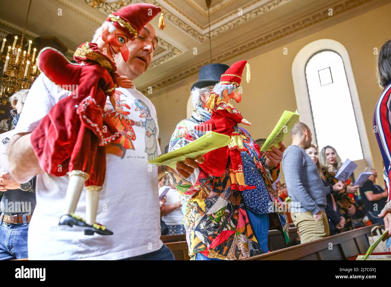 London, UK, 8th May 2022. Puppeteers bring their puppets to the church ...