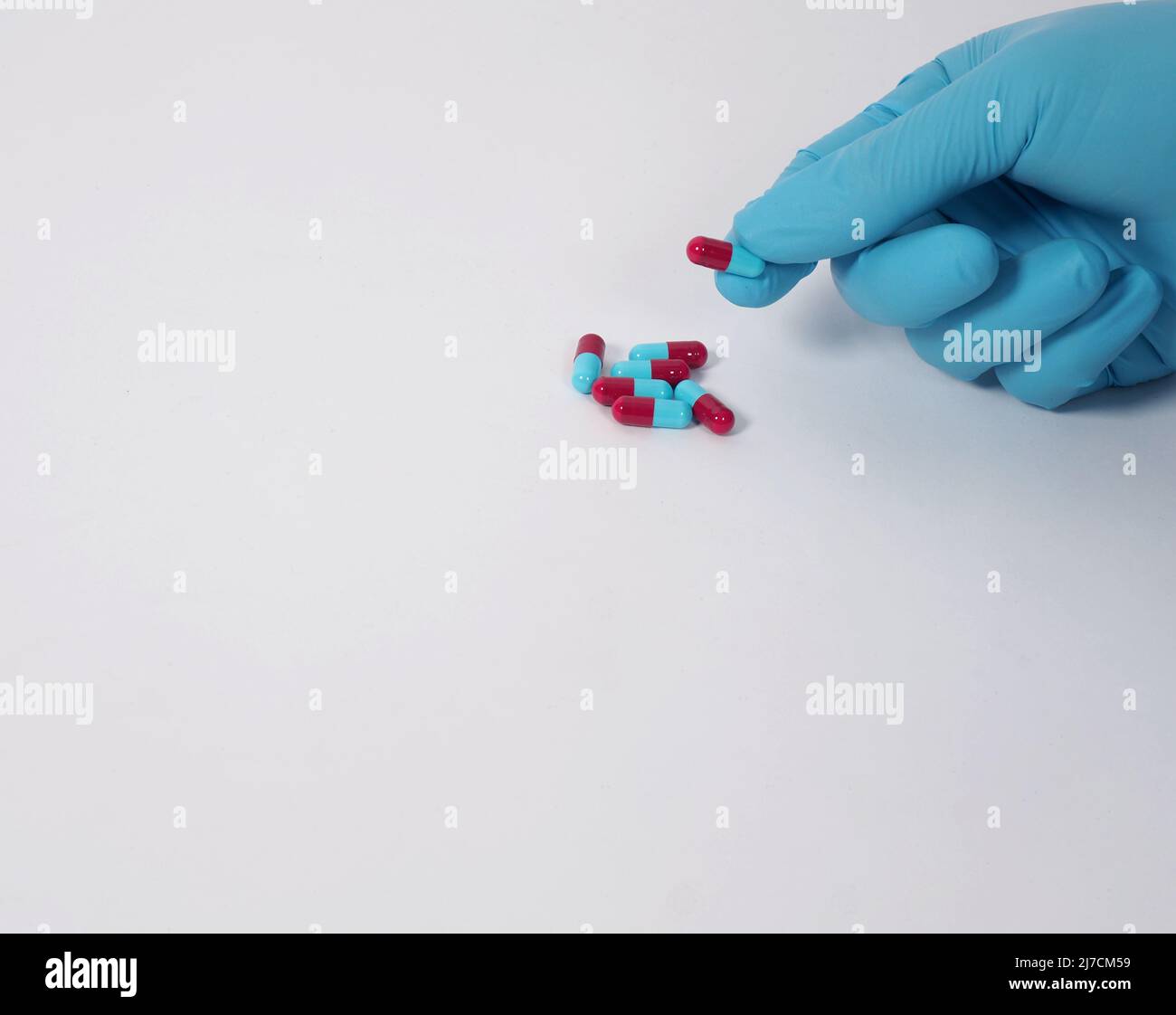 Taking or holding medication pills in hand. Capsule pill on white ...