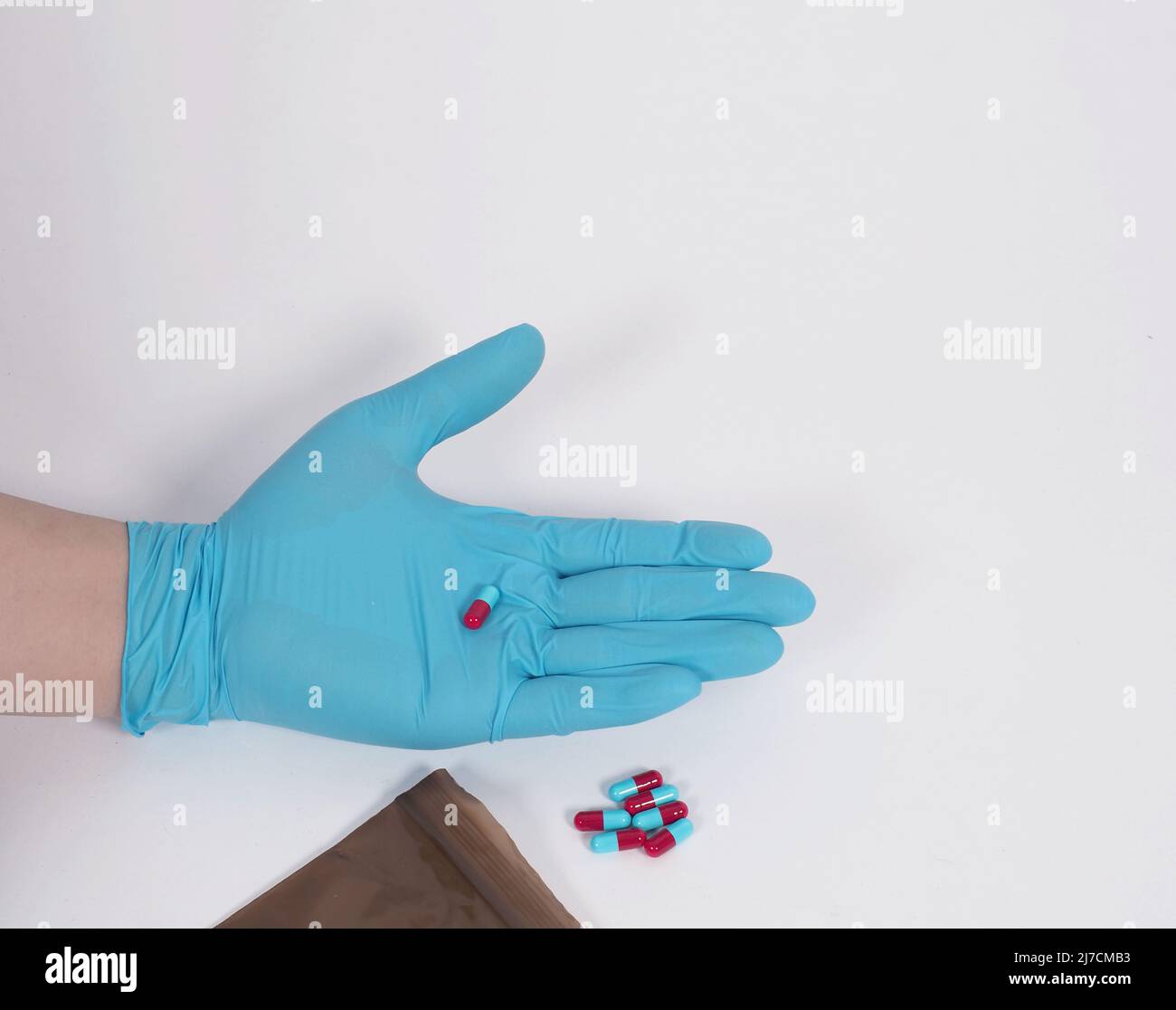 Taking or holding medication pills in hand. Capsule pill on white ...