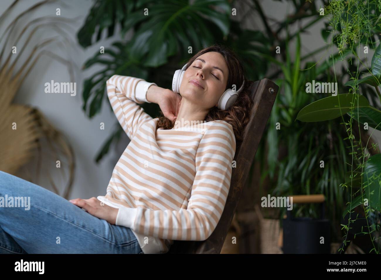 Relaxed young female resting from work, relaxing feels happy breathing ...