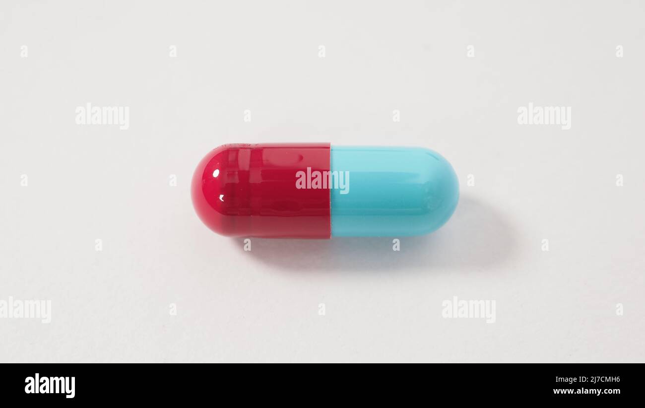 Taking or holding medication pills in hand. Capsule pill on white ...