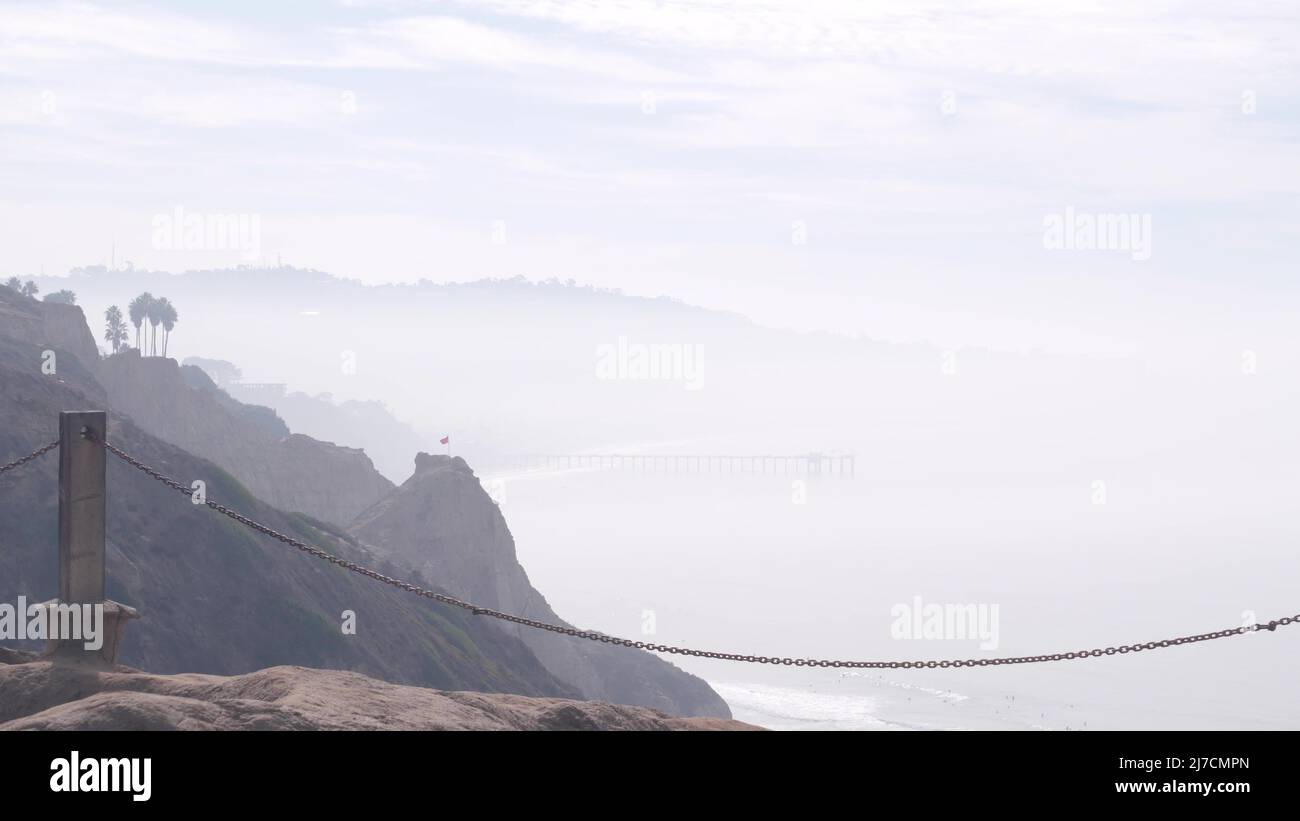Steep unstable cliff, rock or bluff, foggy weather, California coast ...