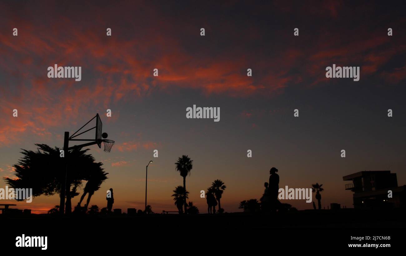 Silhouettes basketball players sunset hi-res stock photography and ...