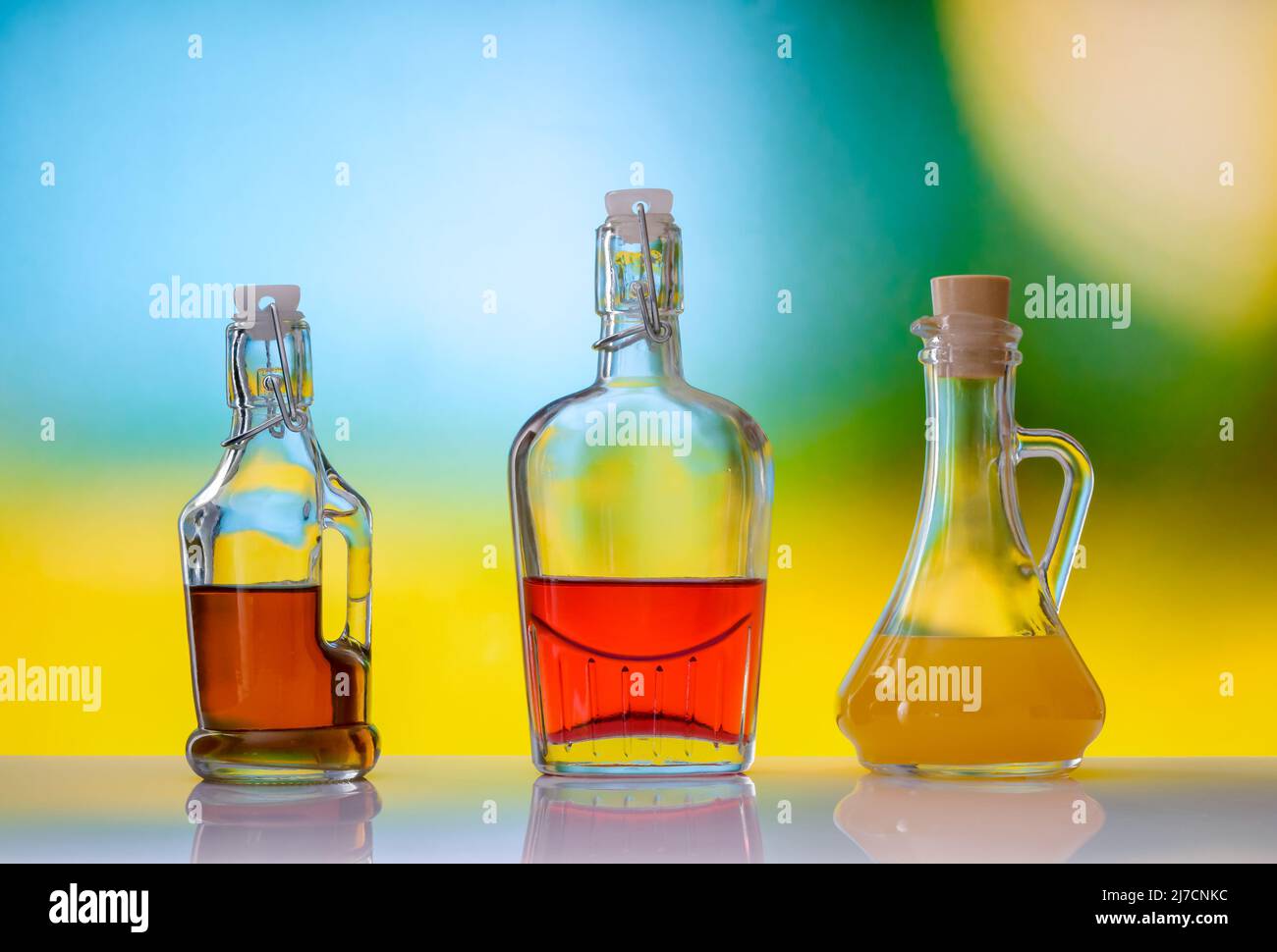 stylish bottles with colored alcohol, drinks on a soft blurred ...