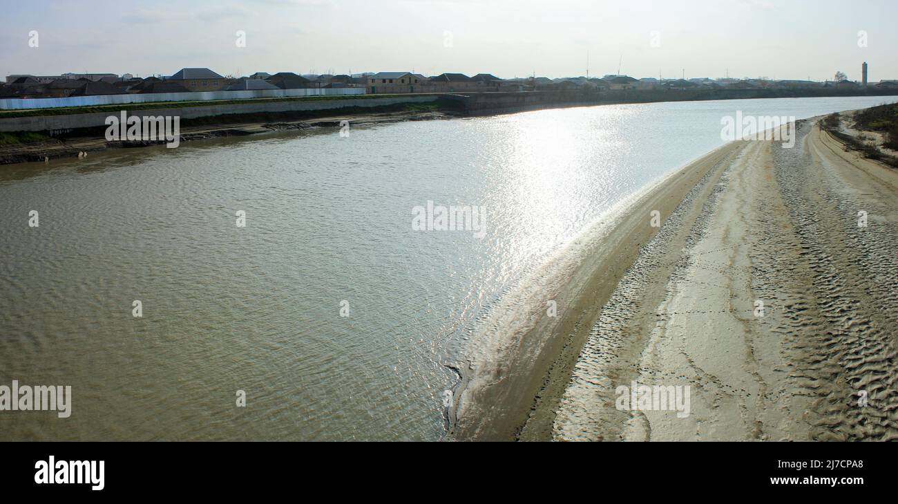 Curved bank of the Kura river. The village of Neftechala. Azerbaijan ...