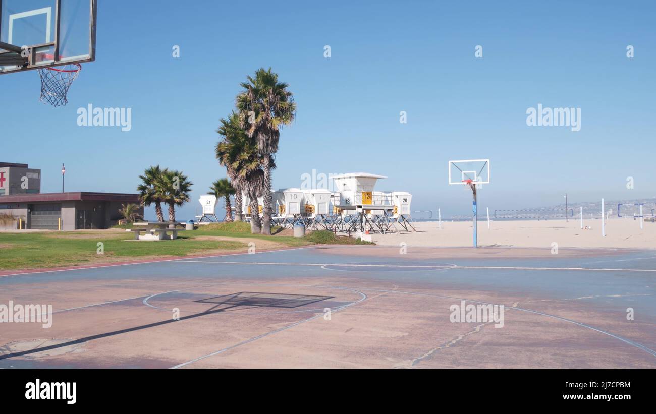 Palm trees and basketball sport field or court on beach, California ...