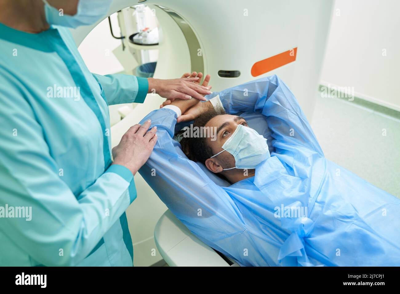 Female doctor helping male patient during MRI Stock Photo - Alamy