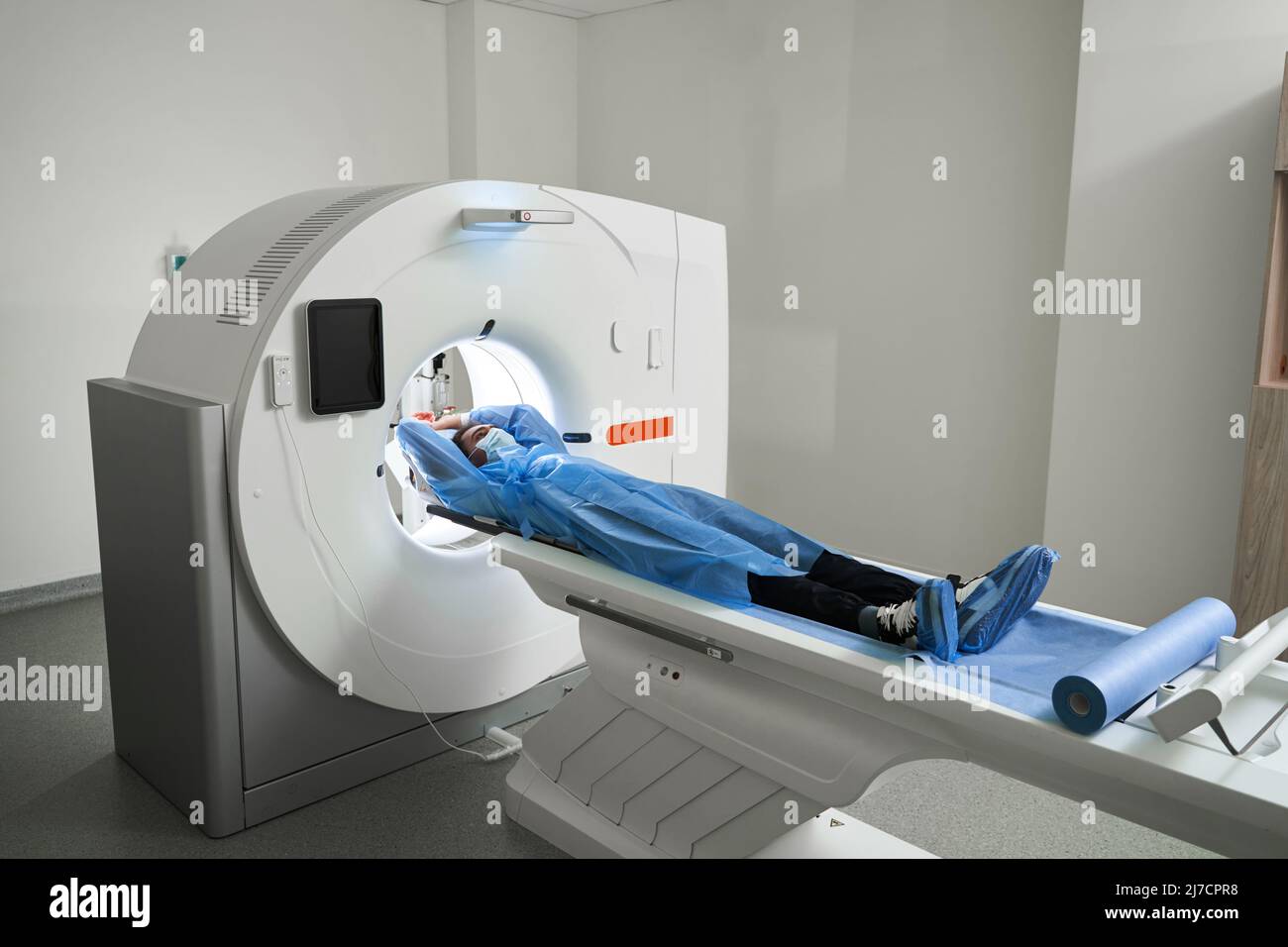 Young man during MRI check-up in hospital Stock Photo - Alamy
