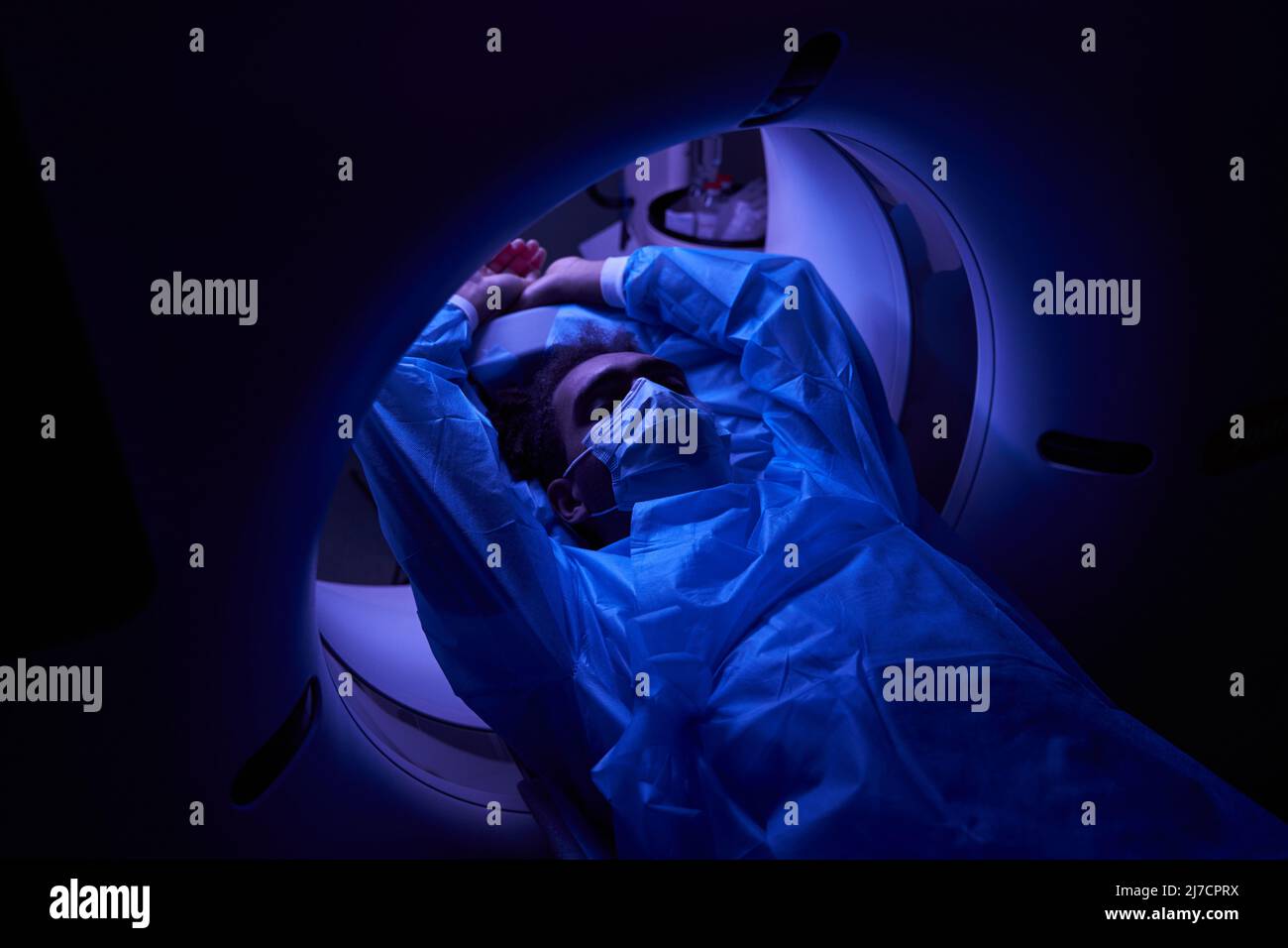 Male patient in robe inside medical scanner Stock Photo - Alamy