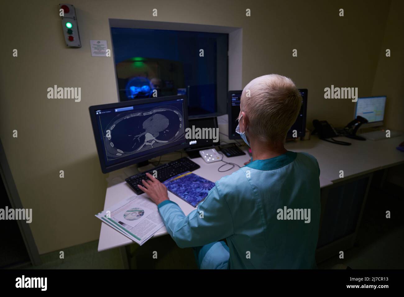 Doctor using computer during MRI of male patient Stock Photo - Alamy