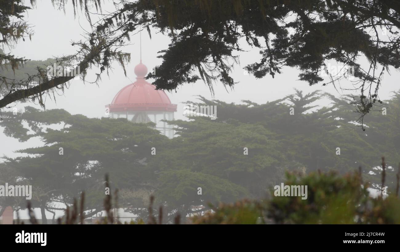 Point Pinos old historic lighthouse fresnel lens glowing, foggy rainy ...