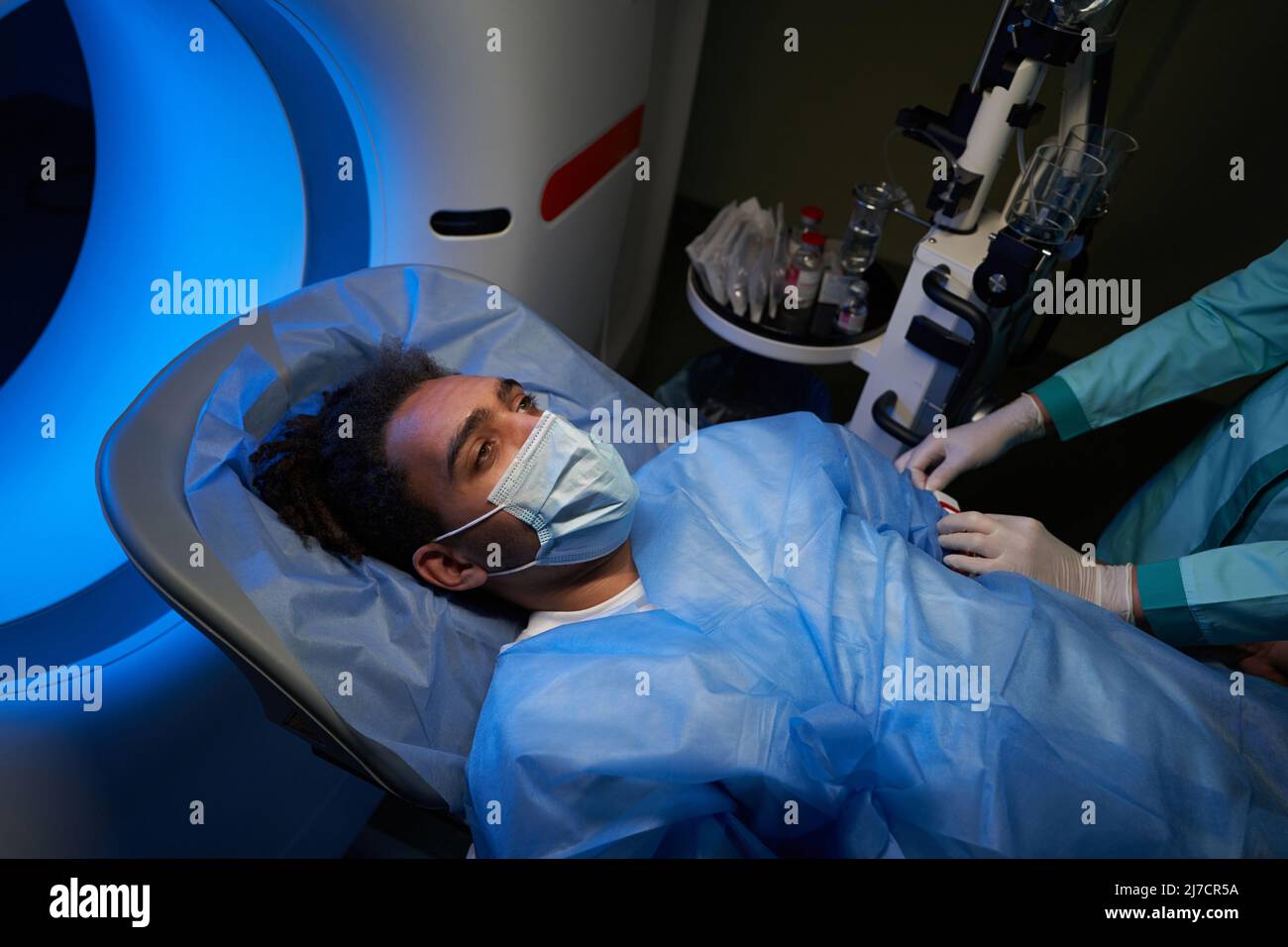Young man getting medicine before starting MRI diagnosis Stock Photo ...