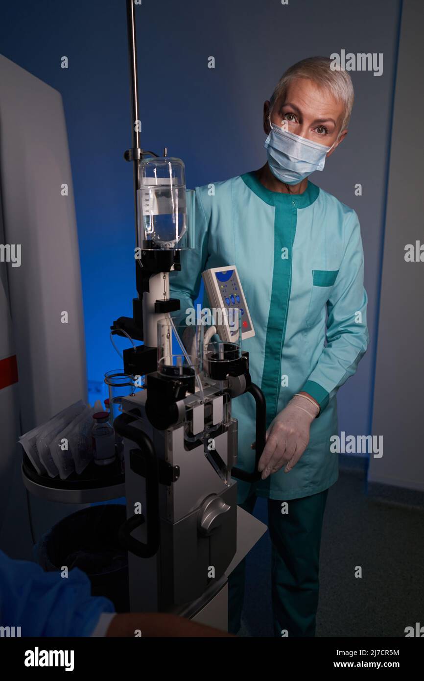 Female doctor using modern medical equipment with dropper Stock Photo ...