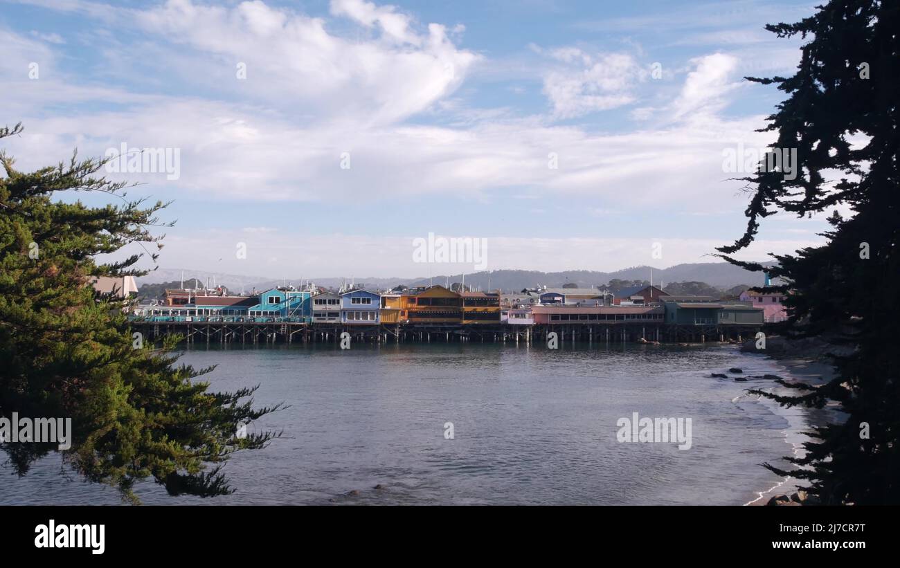 Colorful wooden houses on piles, pillars or pylons, ocean sea water ...