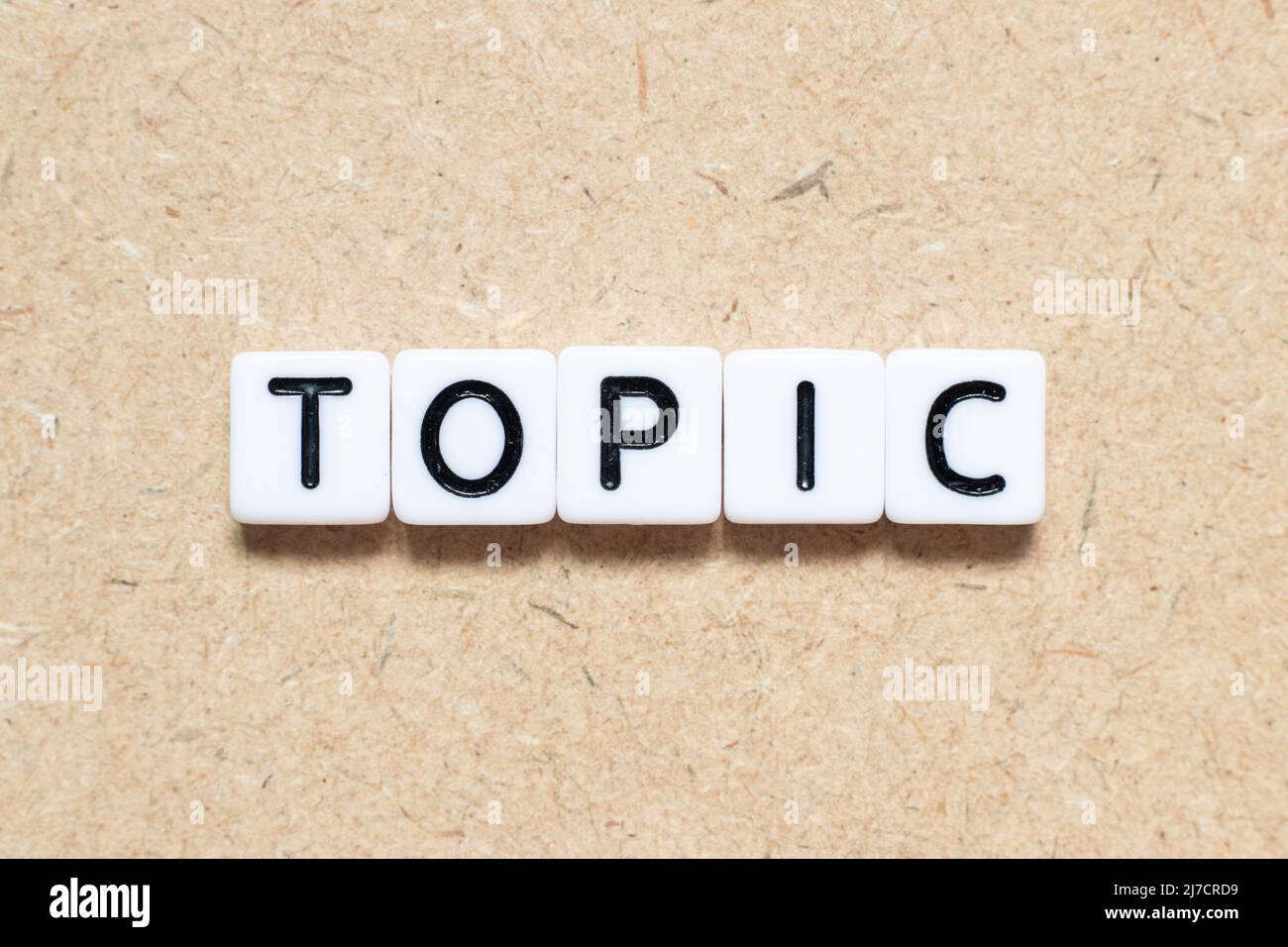 White tile alphabet letter with word topic on wood background Stock ...