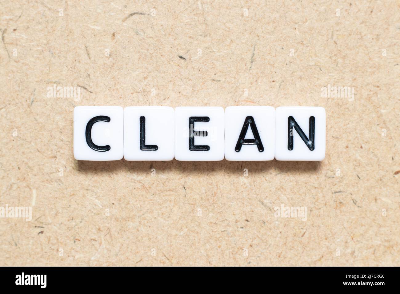 White tile alphabet letter with word clean on wood background Stock ...