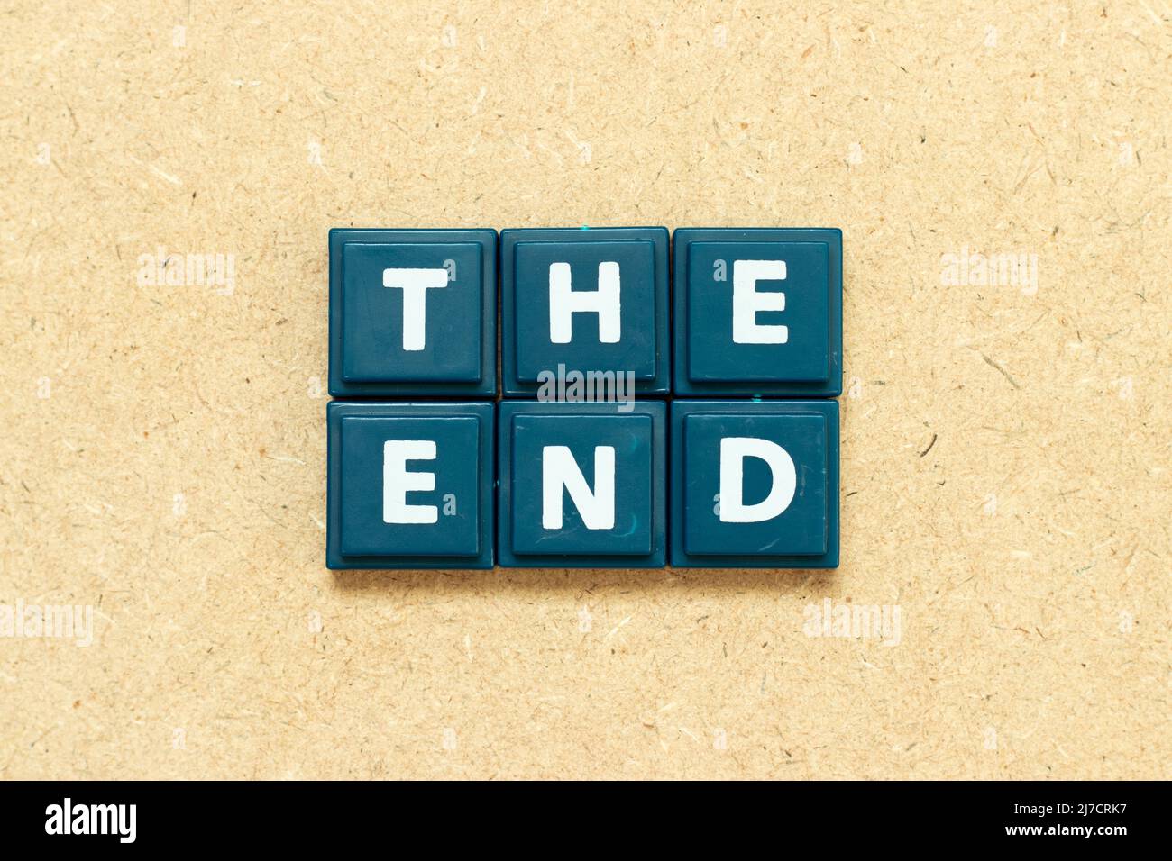 Tile alphabet letter in word the end on wood background Stock Photo - Alamy