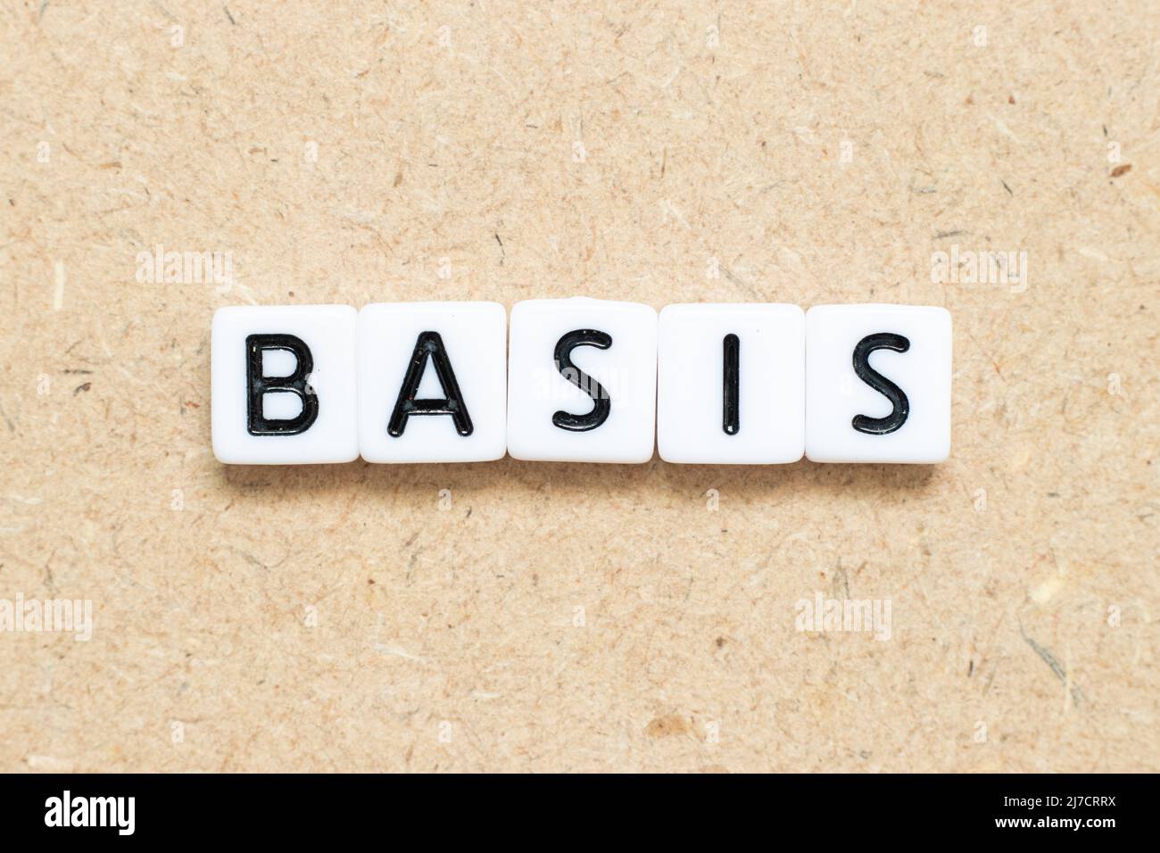 White tile alphabet letter with word basis on wood background Stock ...