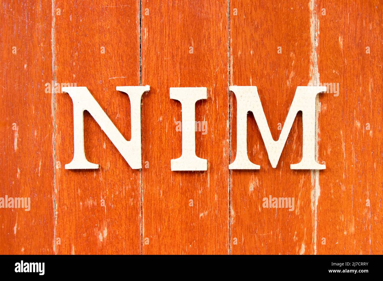 Alphabet letter in word NIM (Abbreviation of Net interest margin) on ...