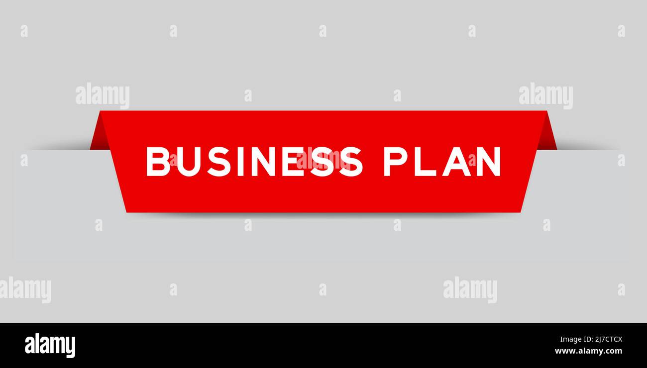 Red color inserted label with word business plan on gray background ...